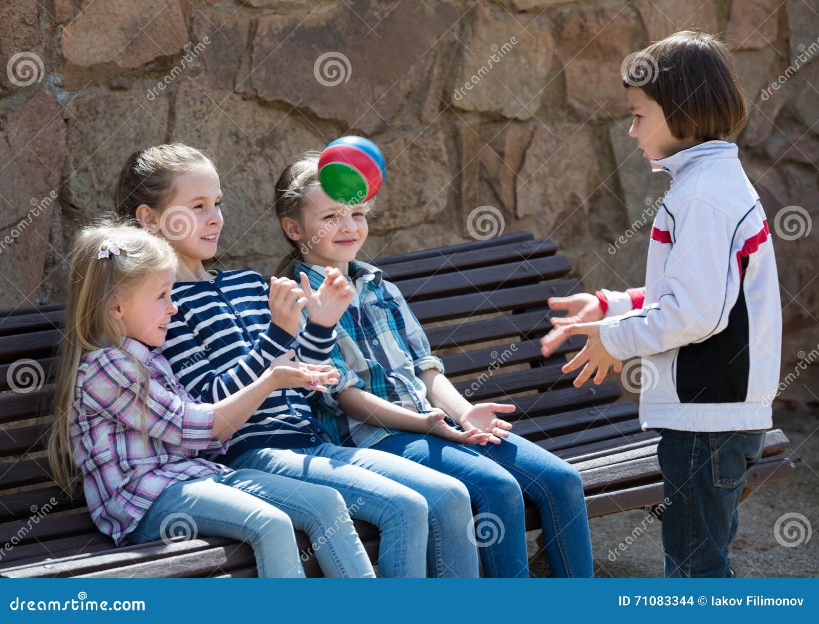Children on the Bench Playing with Ball Stock Photo - Image of ...