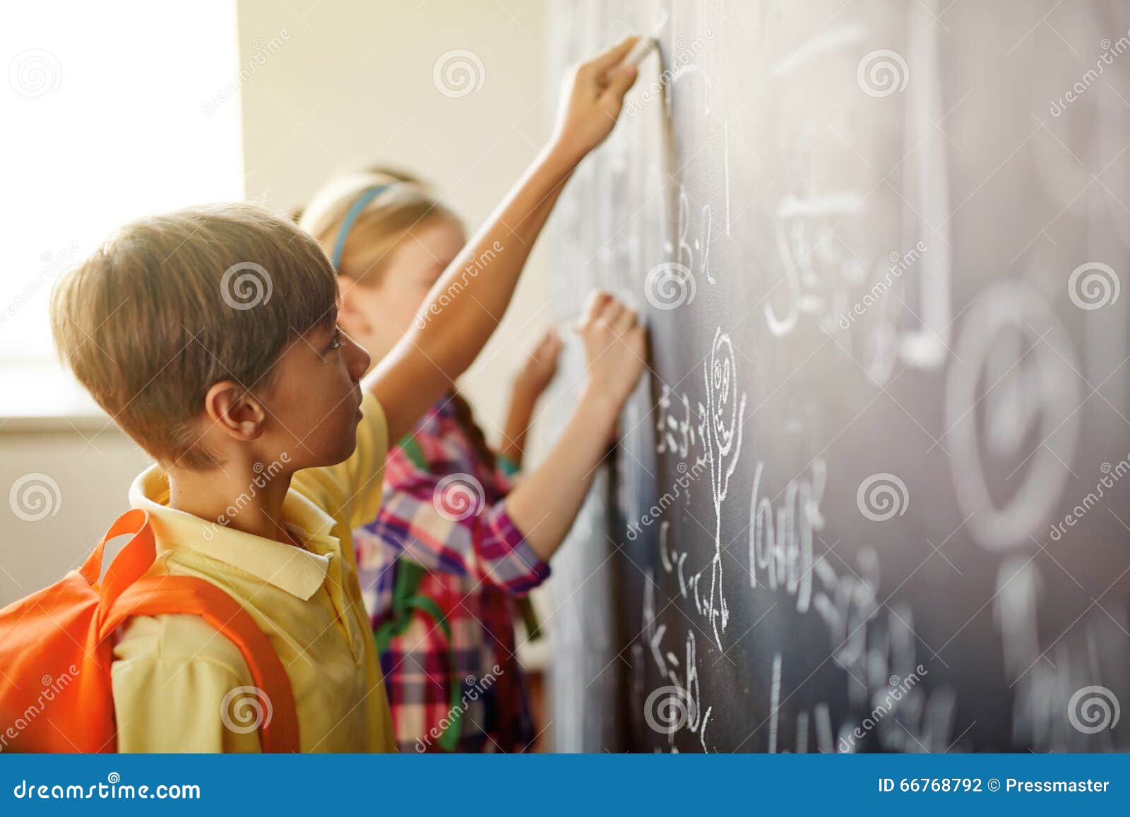 Children by blackboard stock photo. Image of education - 66768792