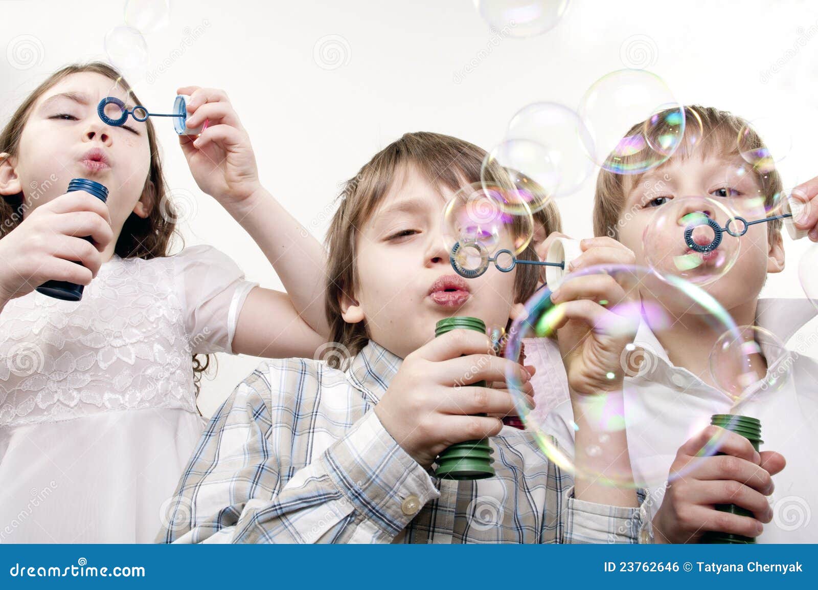 Children blowing bubbles stock photo. Image of person - 23762646