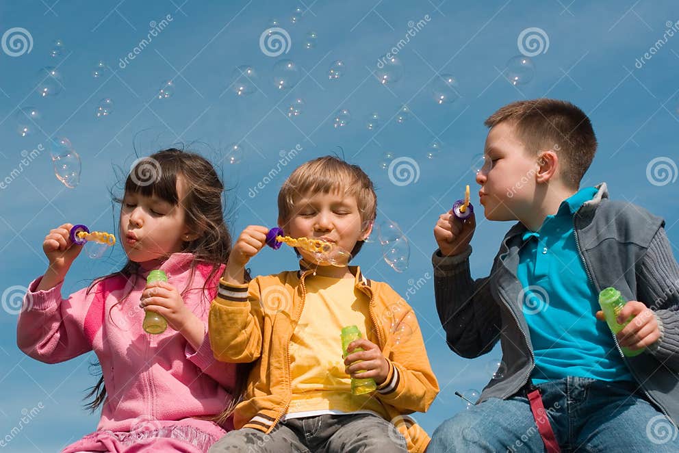 Children blowing bubbles stock photo. Image of kids, brother - 2427876