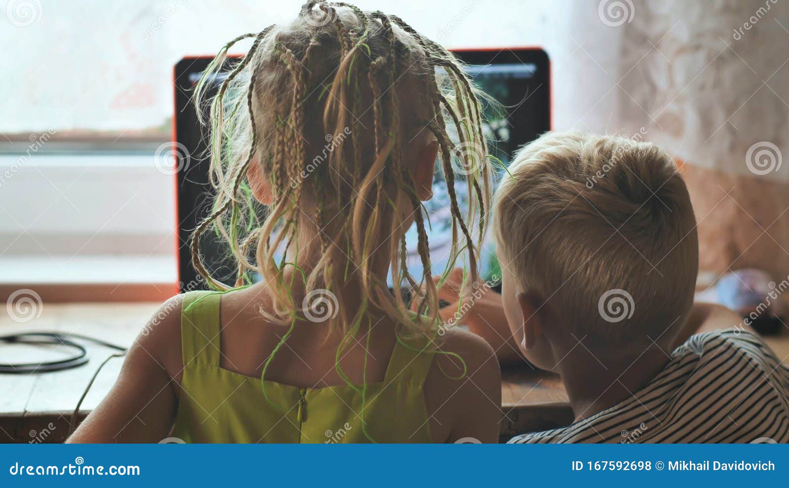 Children are Browsing Photos on a Laptop. Stock Photo - Image of ...