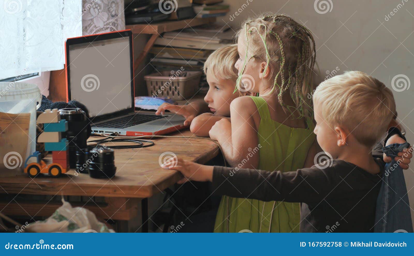 Children are Browsing Photos on a Laptop. Stock Photo - Image of ...