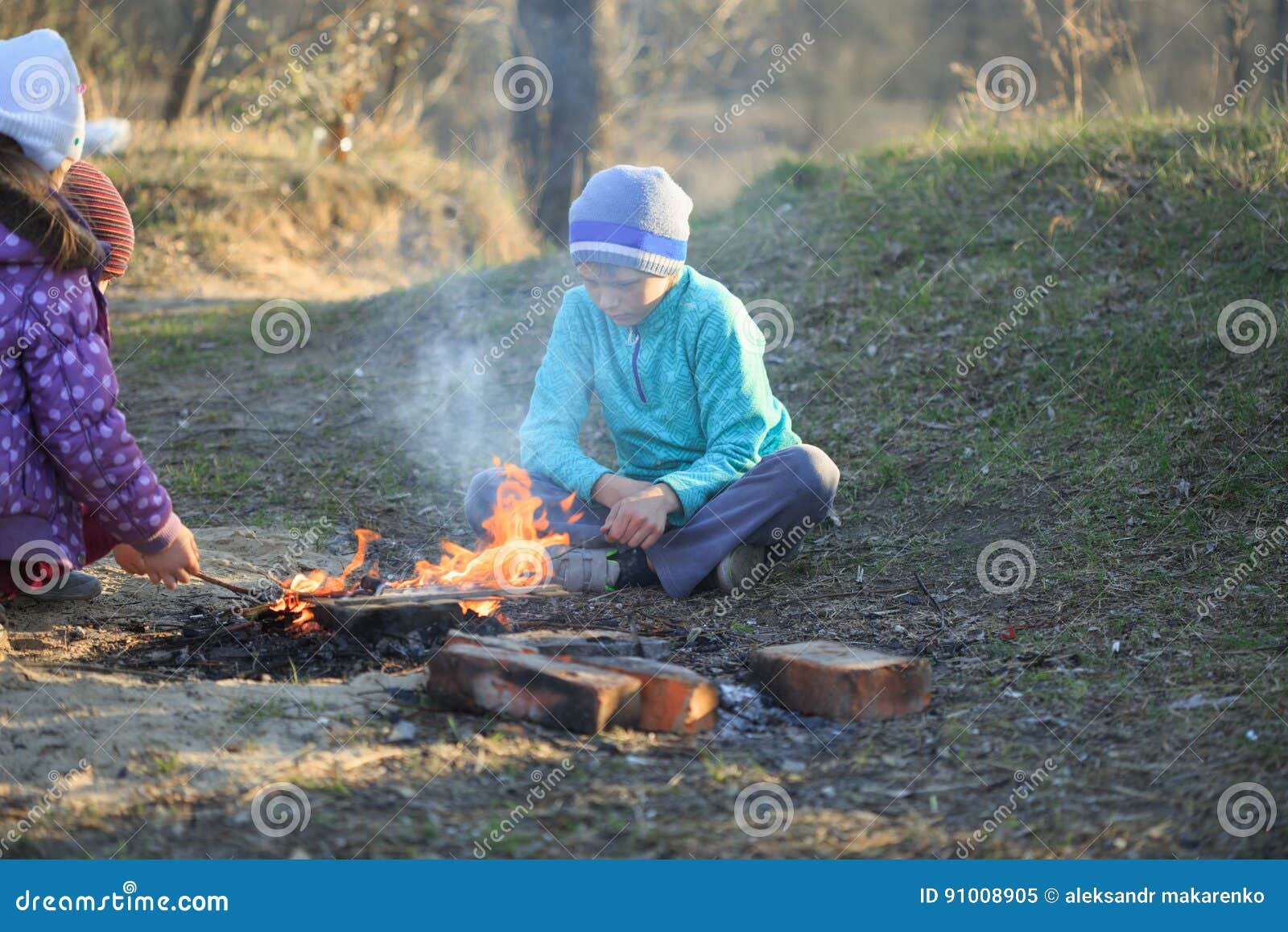 Children Burn a Bonfire in the Spring on a Picnic Stock Image - Image ...