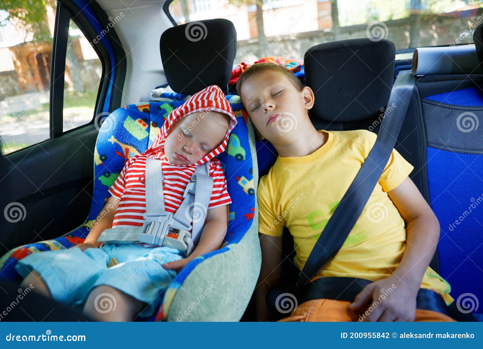 Children in the Car Sleep in a Child Seat with Seat Belts Stock Photo ...
