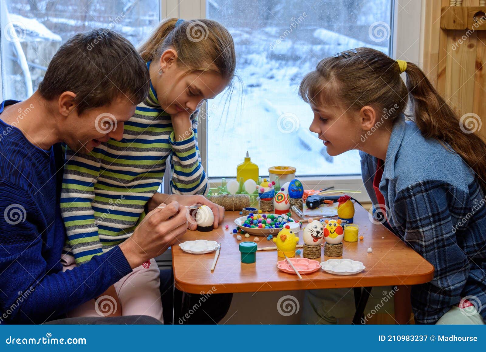 Children Carefully Watch Their Dad Paint Eggs Stock Image - Image of ...
