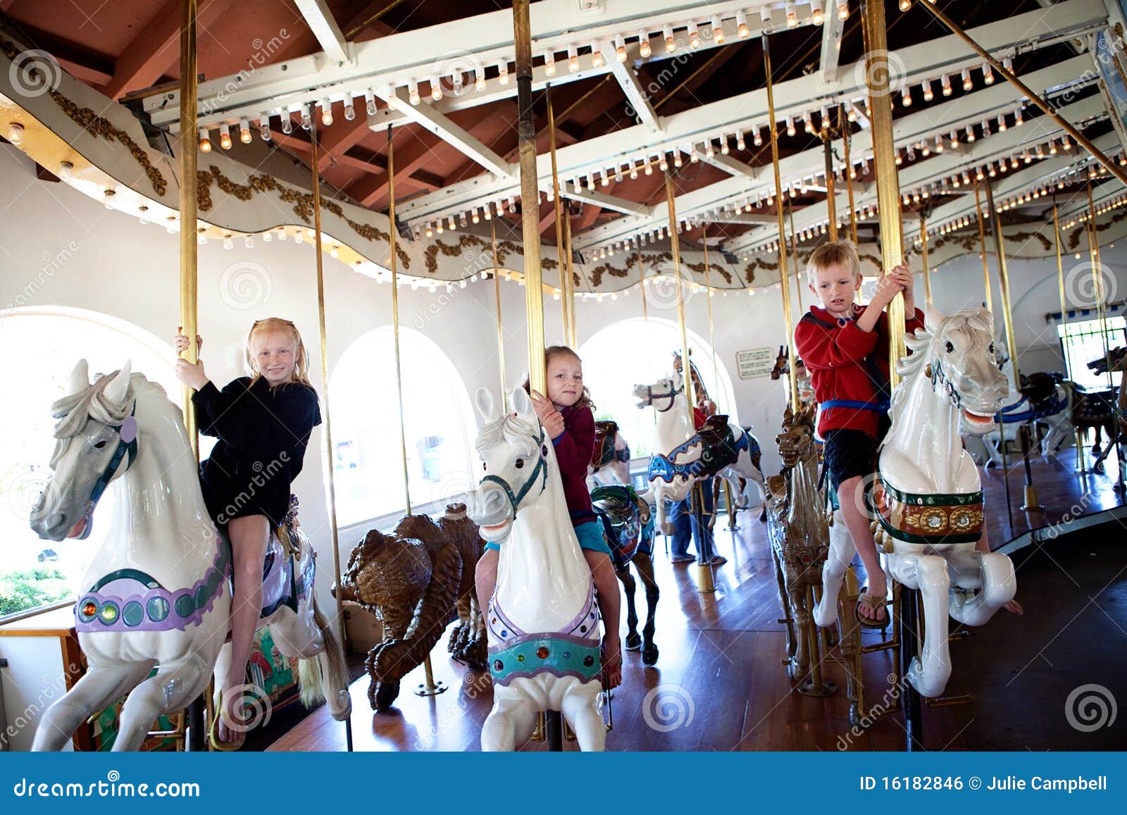 Children on a carousel stock photo. Image of colorful - 16182846