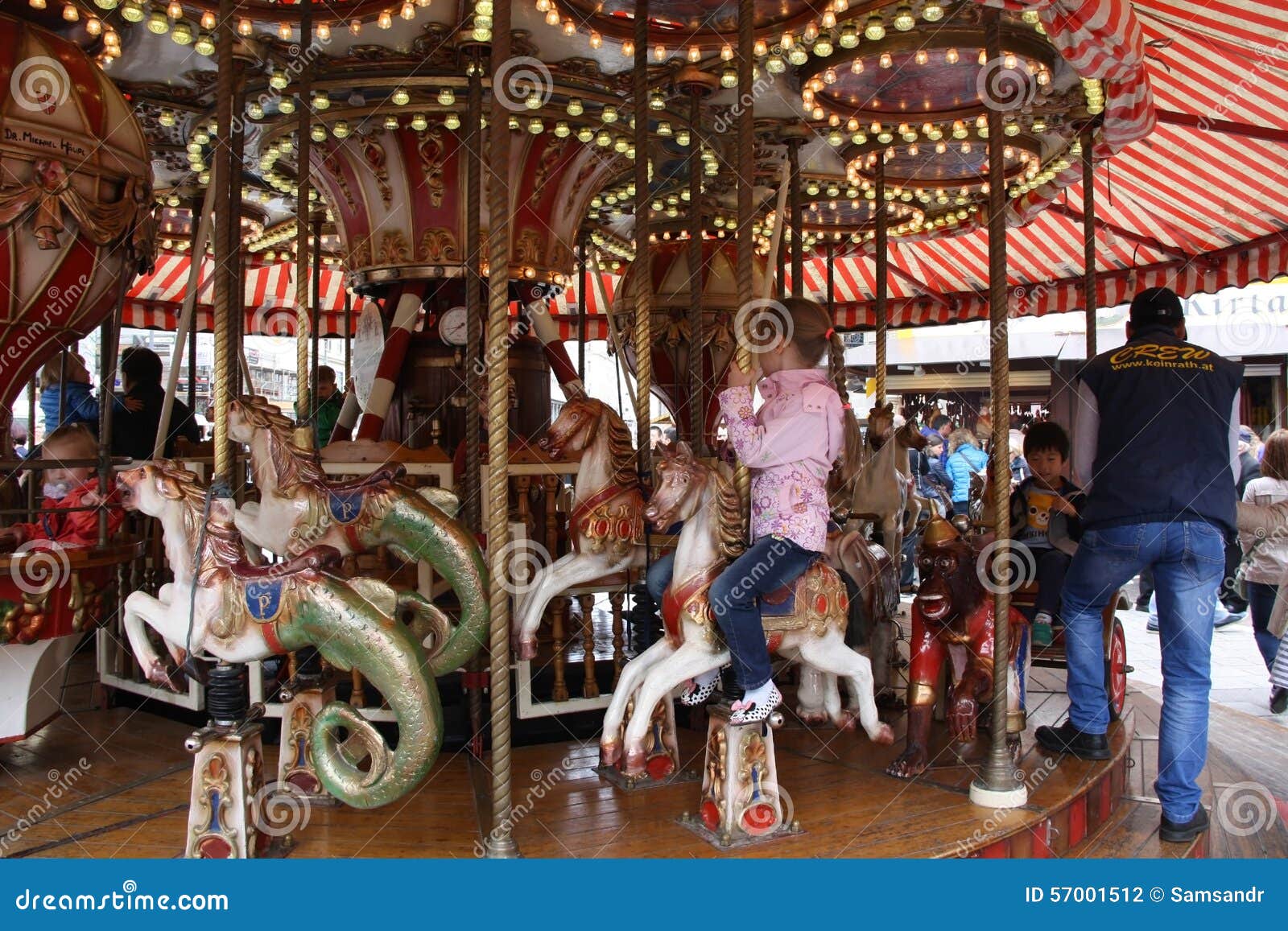 Children on a carousel editorial photography. Image of girl - 57001512