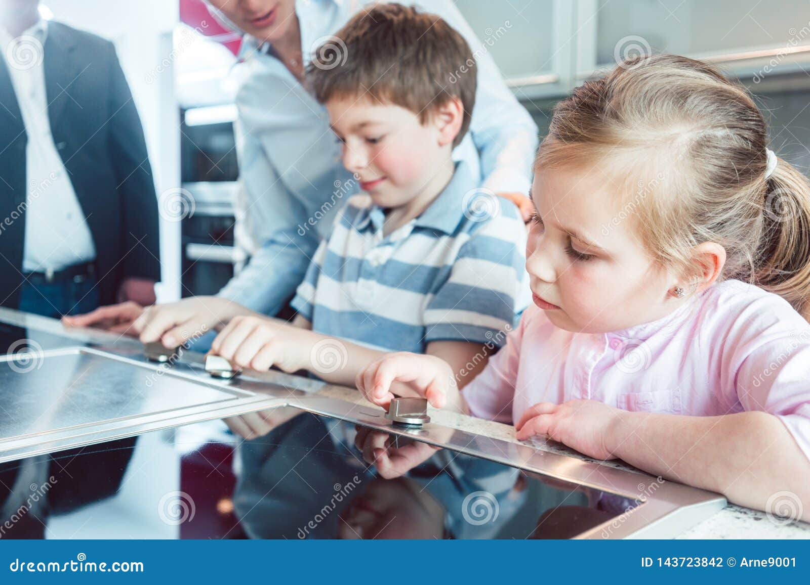 Children Checking Out the New Kitchen Their Parents are about To Buy ...
