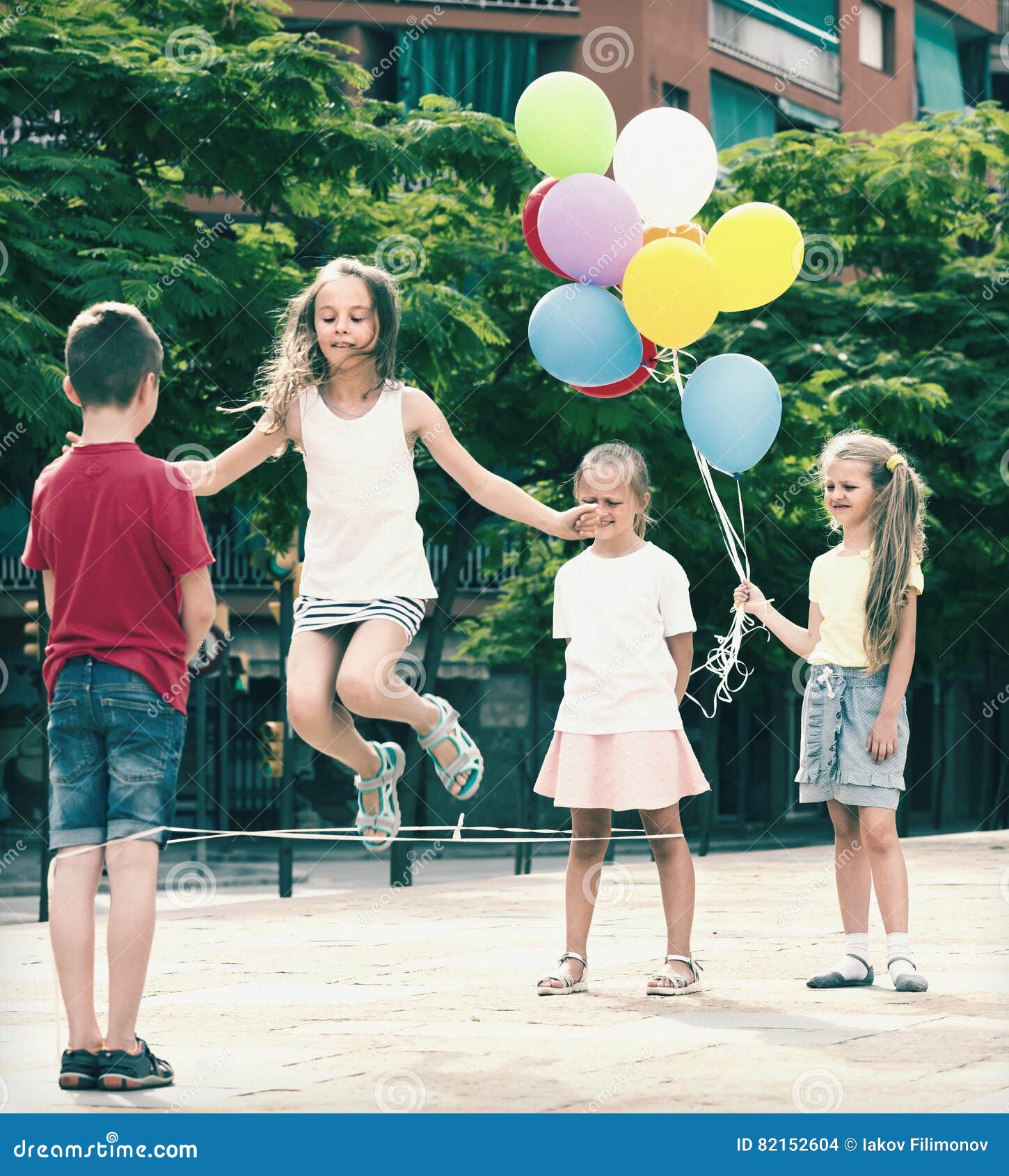Children with Chinese Jumping Rope Stock Photo - Image of motion, group ...