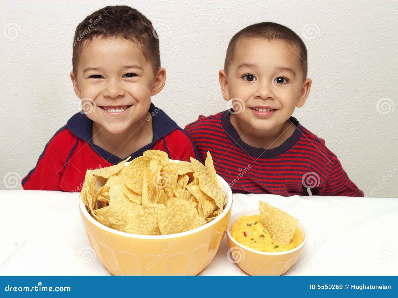 Children and chips stock image. Image of handsome, anticipation - 5550269