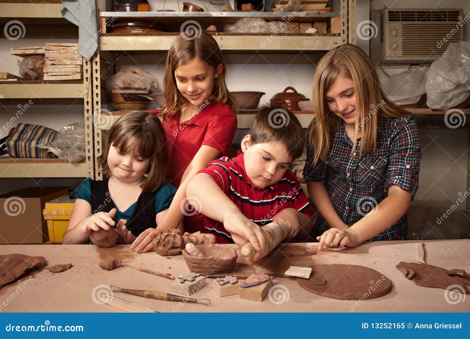Children in a clay studio stock image. Image of earthenware - 13252165