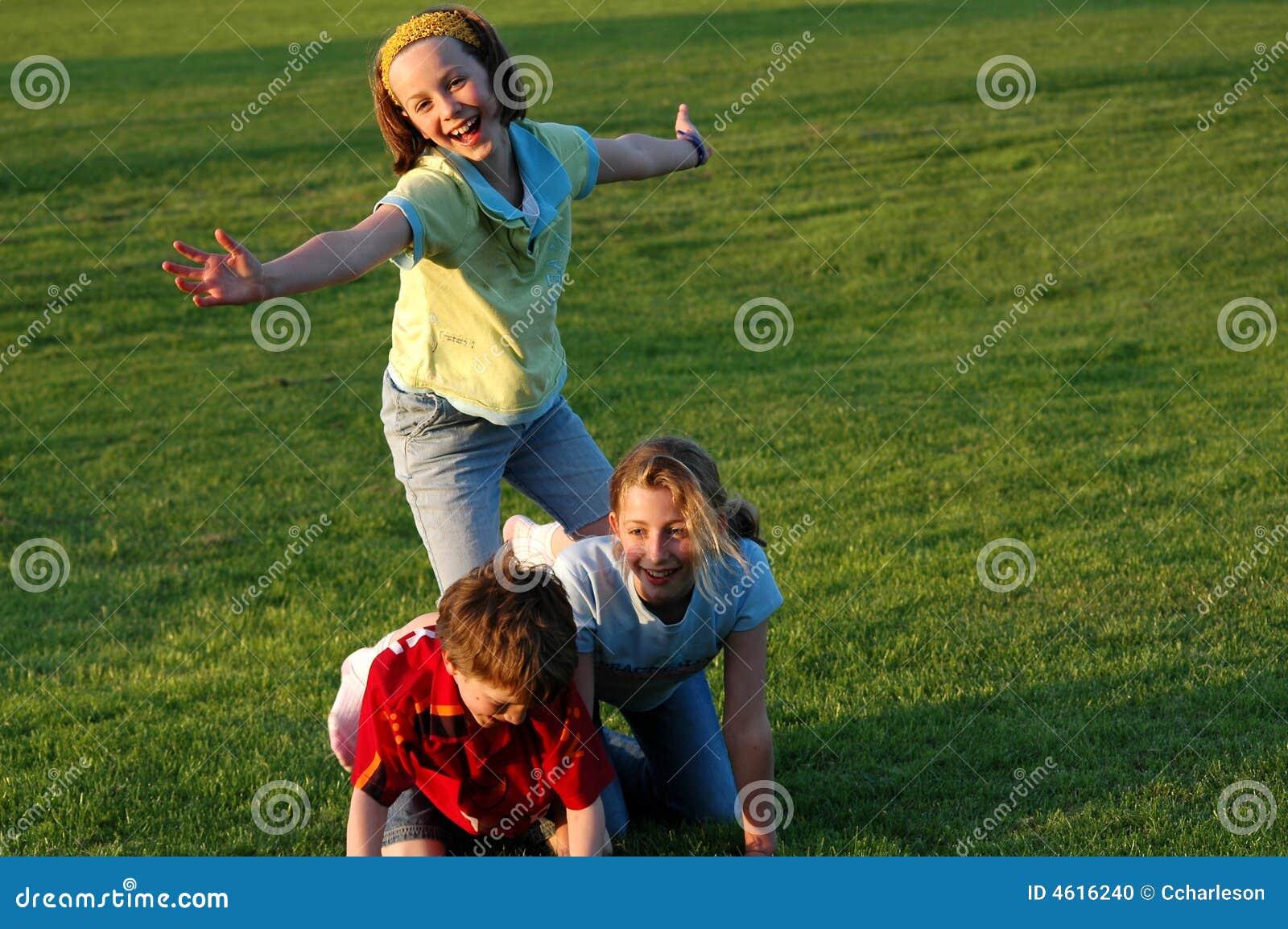 Children Climbing on Each Other at Park Stock Photo - Image of family ...