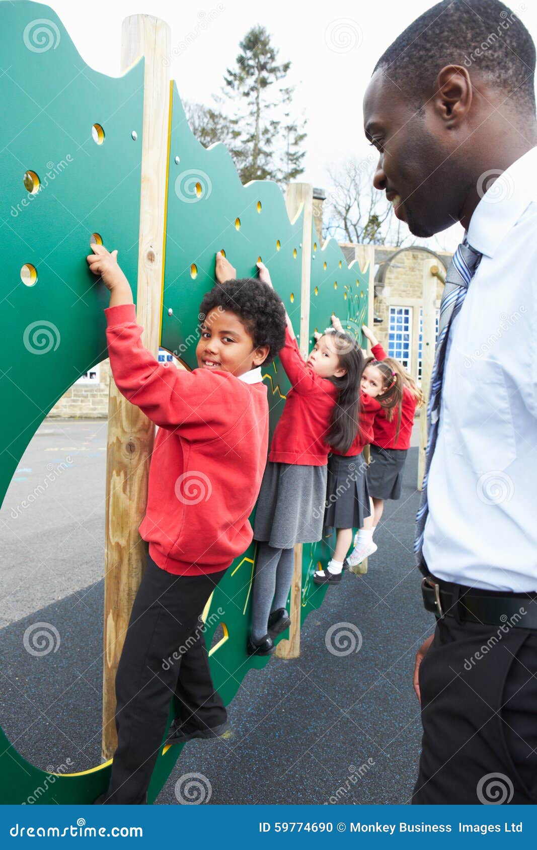Children on Climbing Wall in School Playground at Breaktime Stock Photo ...