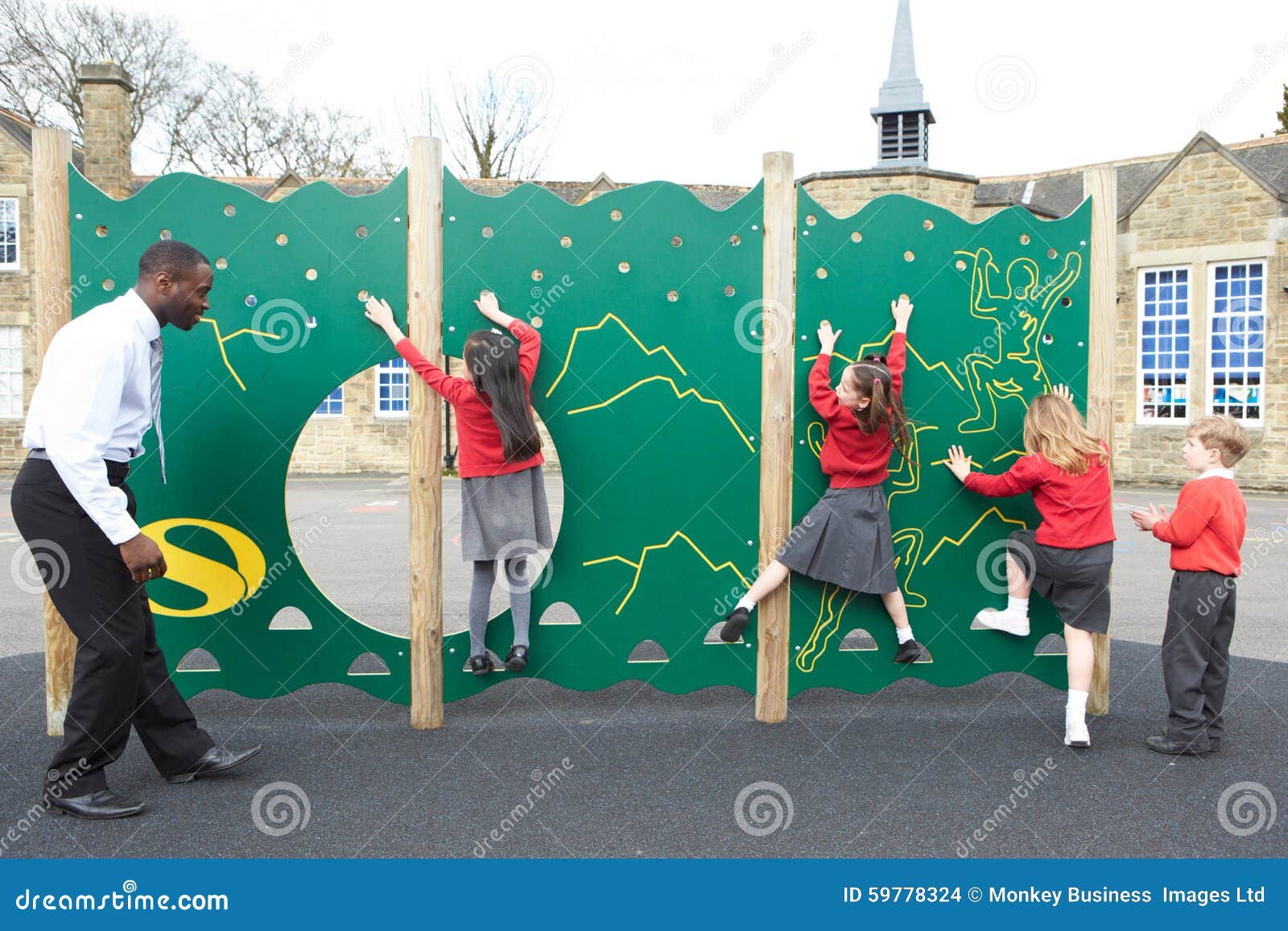 Children on Climbing Wall in School Playground at Breaktime Stock Photo ...