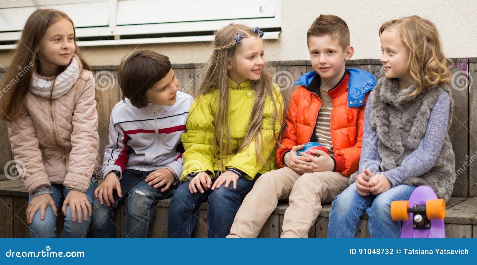 Children Communicate Online On A Computer. The Girl And The Boy Are ...