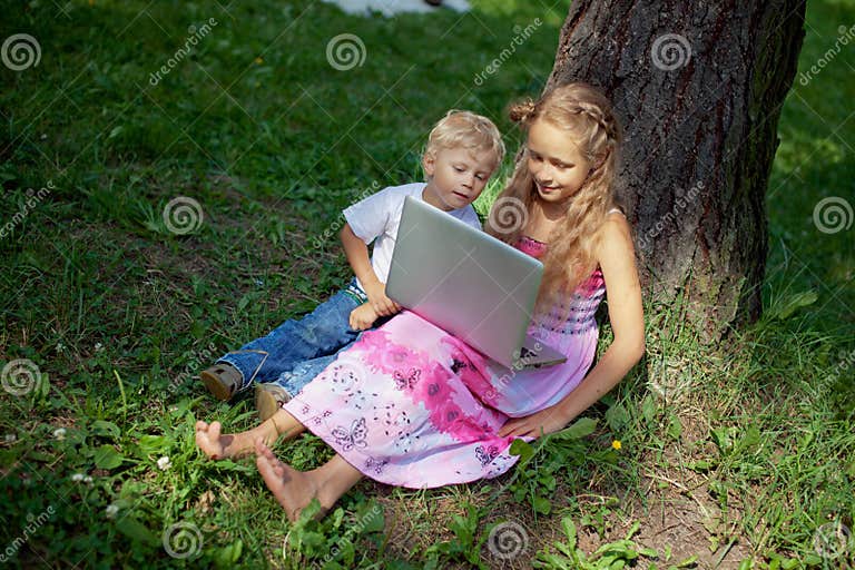 Children with a Computer in the Park, Summertime Stock Image - Image of ...