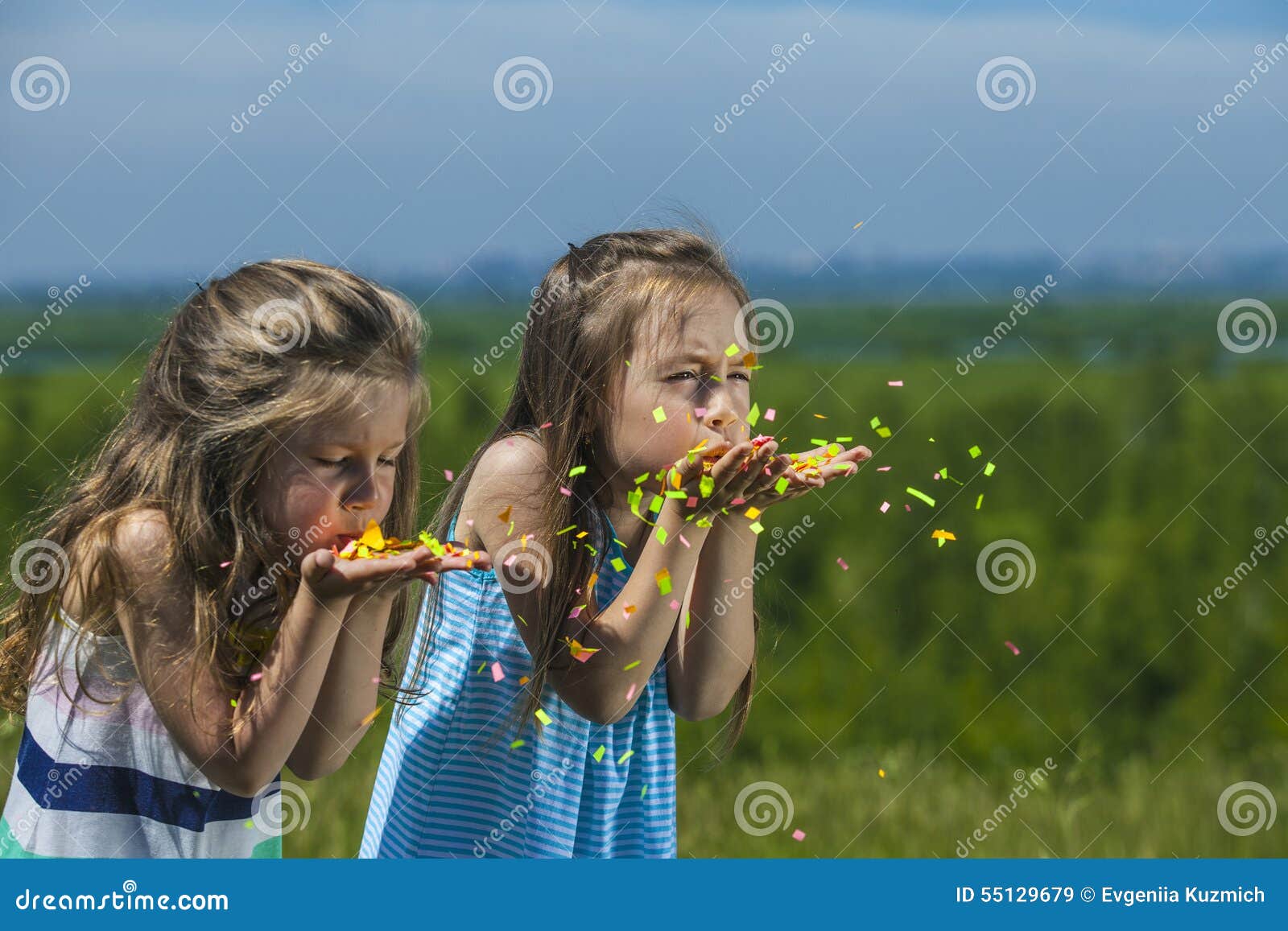 Children with Confetti in Hand Inflate Them in the Wind Stock Image ...