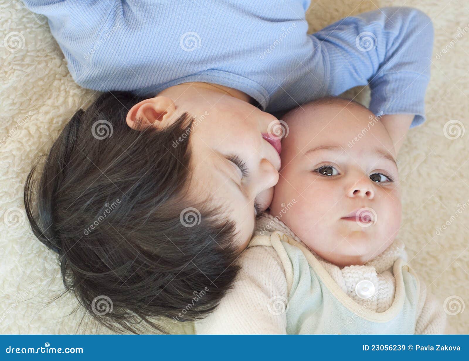 Children cuddling stock image. Image of eyes, face, kissing - 23056239