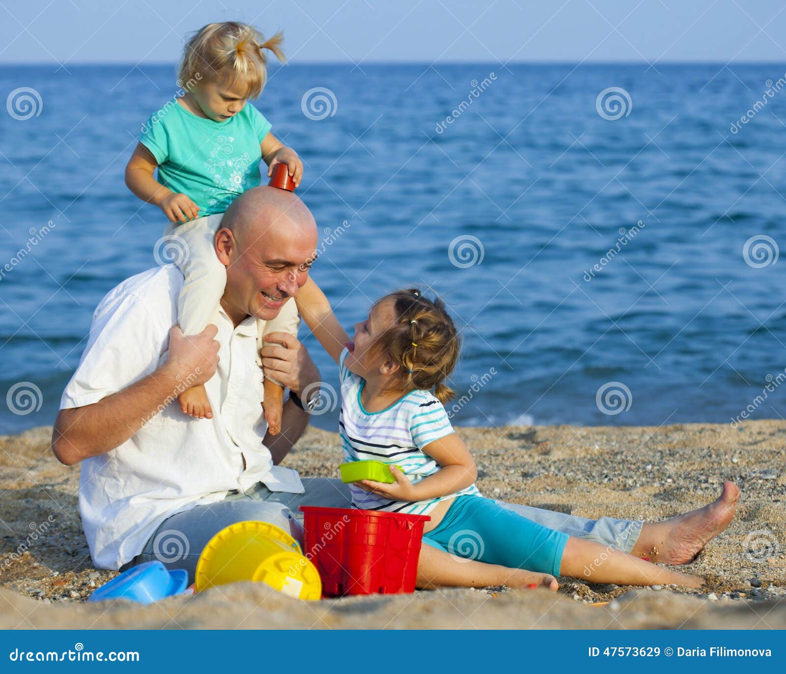 Children with Dad on beach stock image. Image of parenting - 47573629