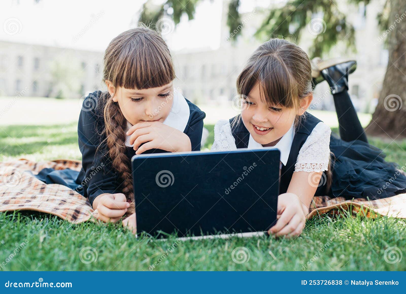 Children on Distance Learning with Laptop Computer Outside. Stock Photo ...