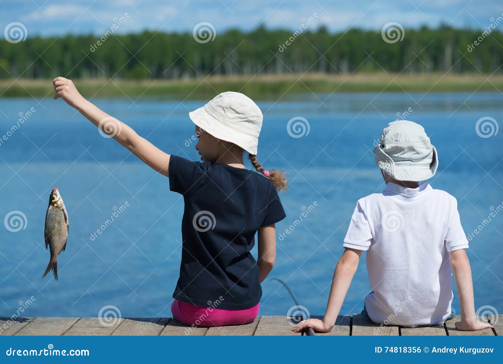Children on the Dock with Fish Stock Photo - Image of people, poles ...