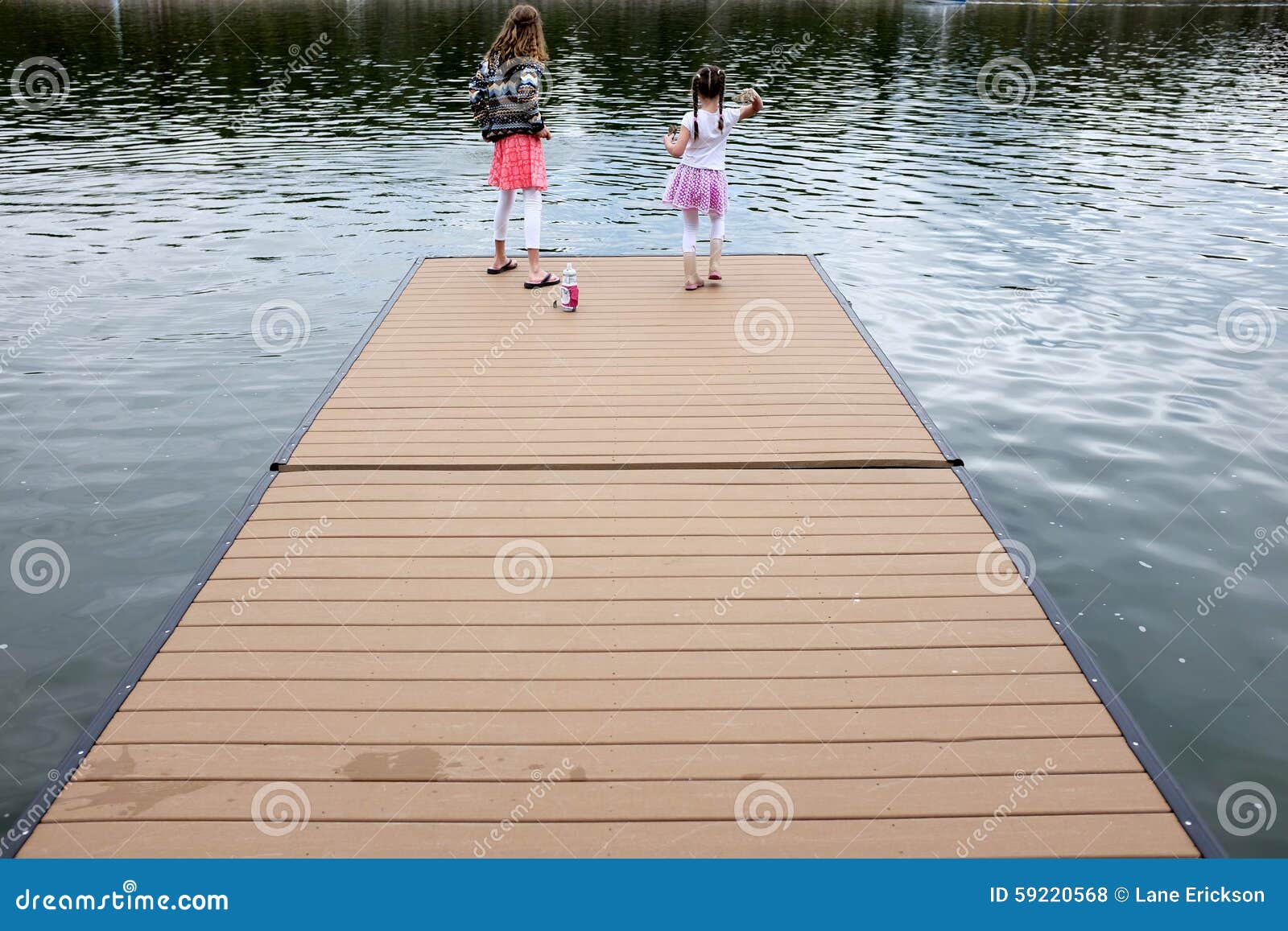 Children on Dock Throwing Rocks Stock Photo - Image of play, nature ...