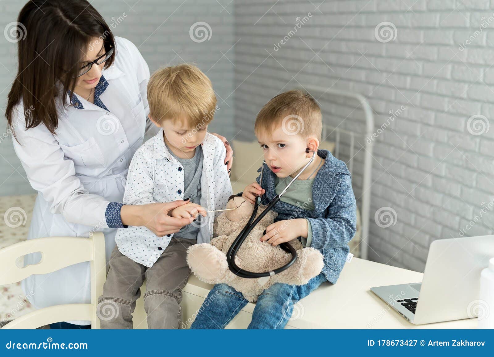 Children Doctors Play with a Toy Patient. Stock Image - Image of child ...