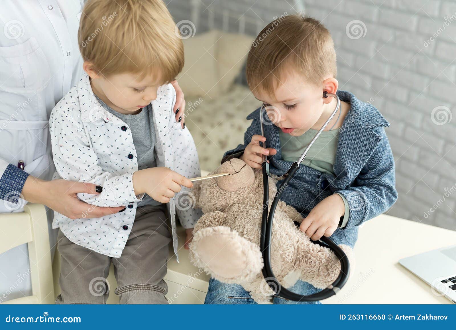 Children Doctors Play with a Toy Patient. Stock Photo - Image of nurse ...
