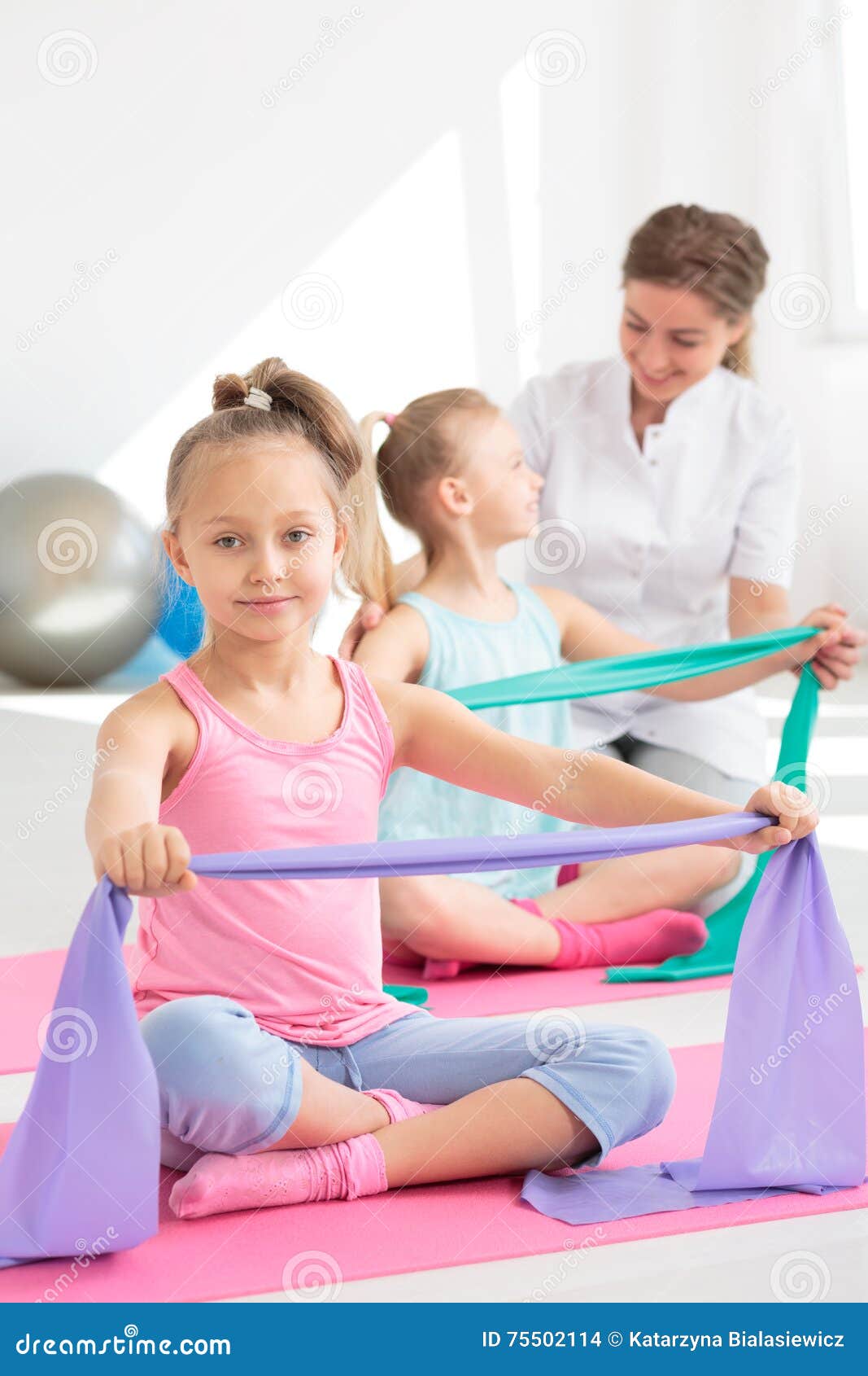 Children doing exercise stock photo. Image of band, health - 75502114