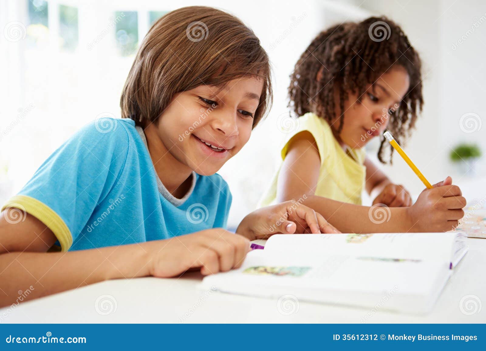 Children Doing Homework in Kitchen Together Stock Photo - Image of ...