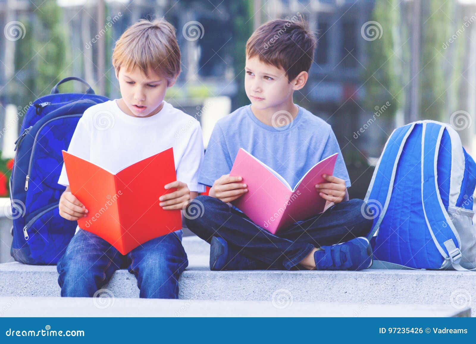 Children Doing Homework Outdoors. Stock Photo - Image of backpack ...