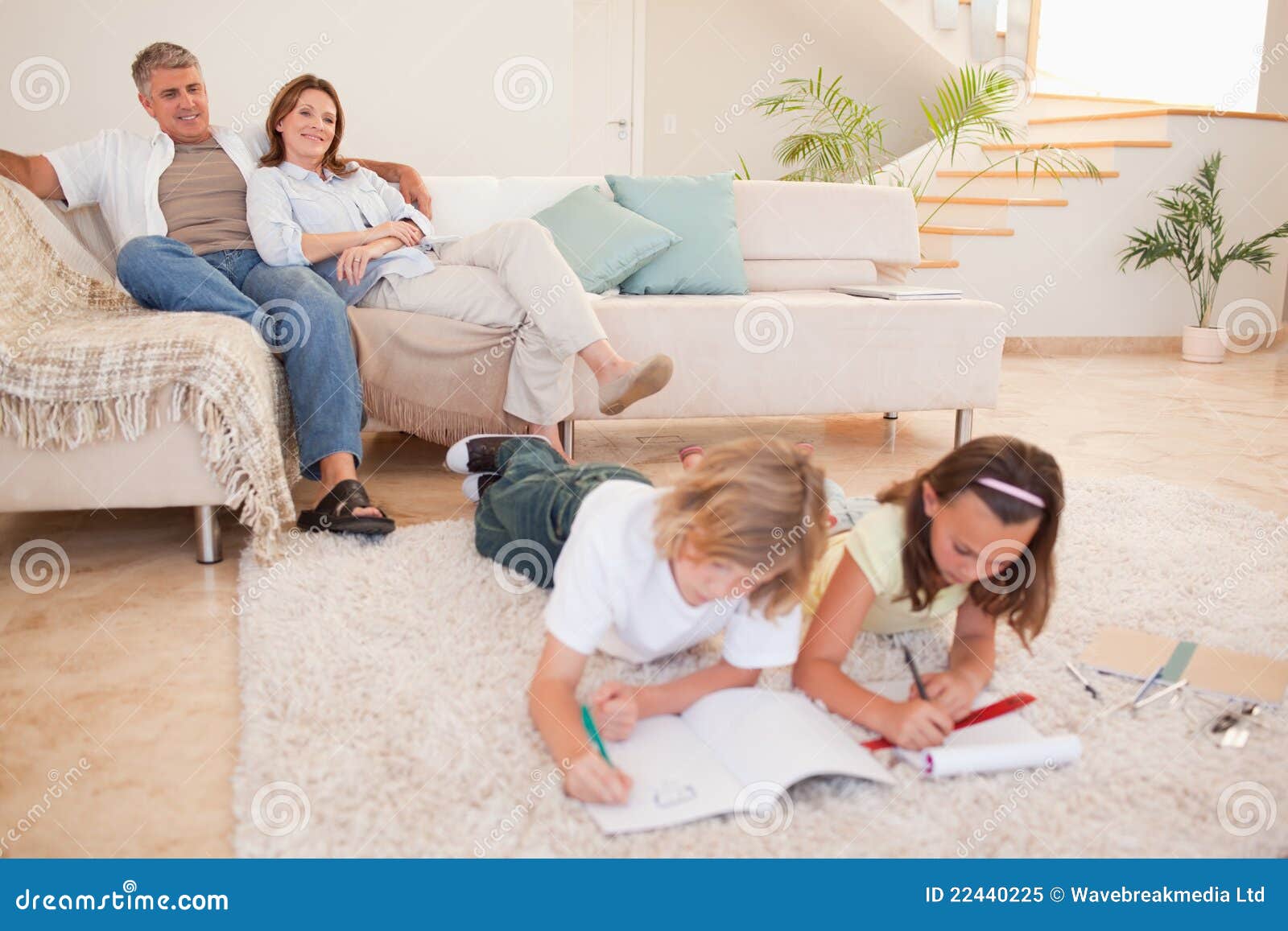Children Doing Homework with Parents Behind Them Stock Image - Image of ...