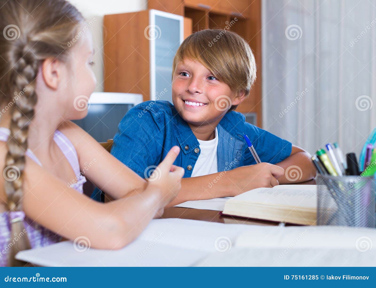 Children doing homework stock image. Image of pupil, happy - 75161285