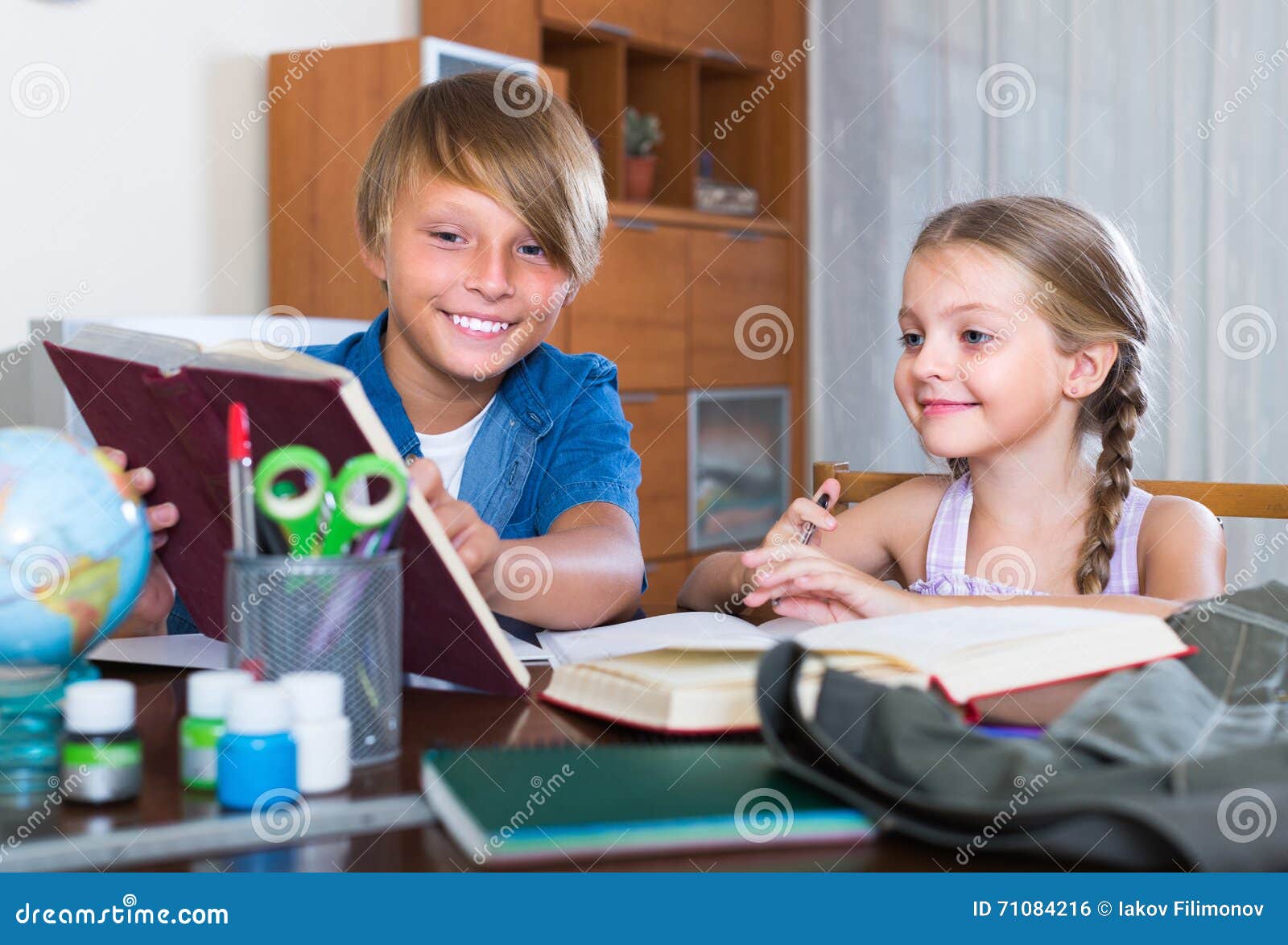Children doing homework stock photo. Image of plaits - 71084216