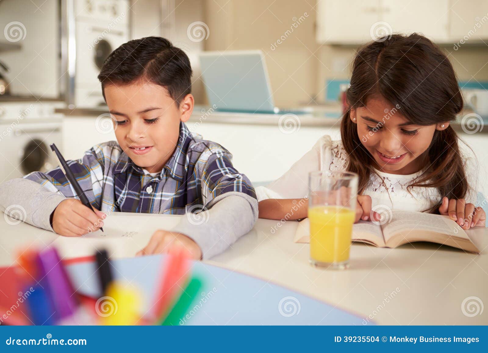 Children Doing Homework Together at Table Stock Photo - Image of ...