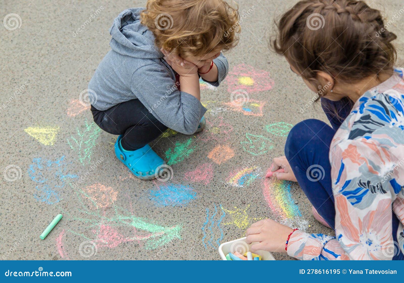 Children Draw with Chalk on the Pavement. Selective Focus Stock Image ...