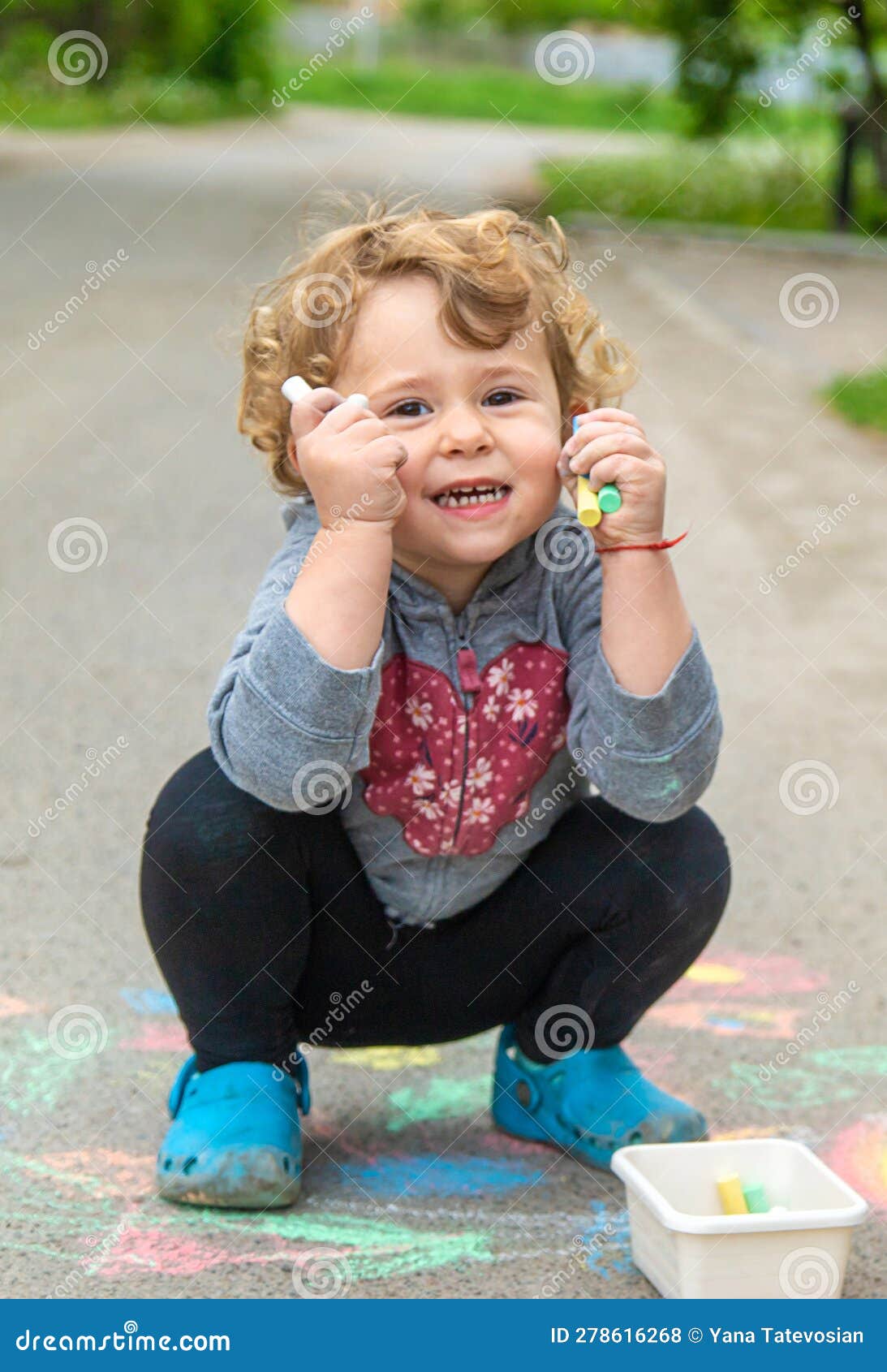 Children Draw with Chalk on the Pavement. Selective Focus Stock Photo ...