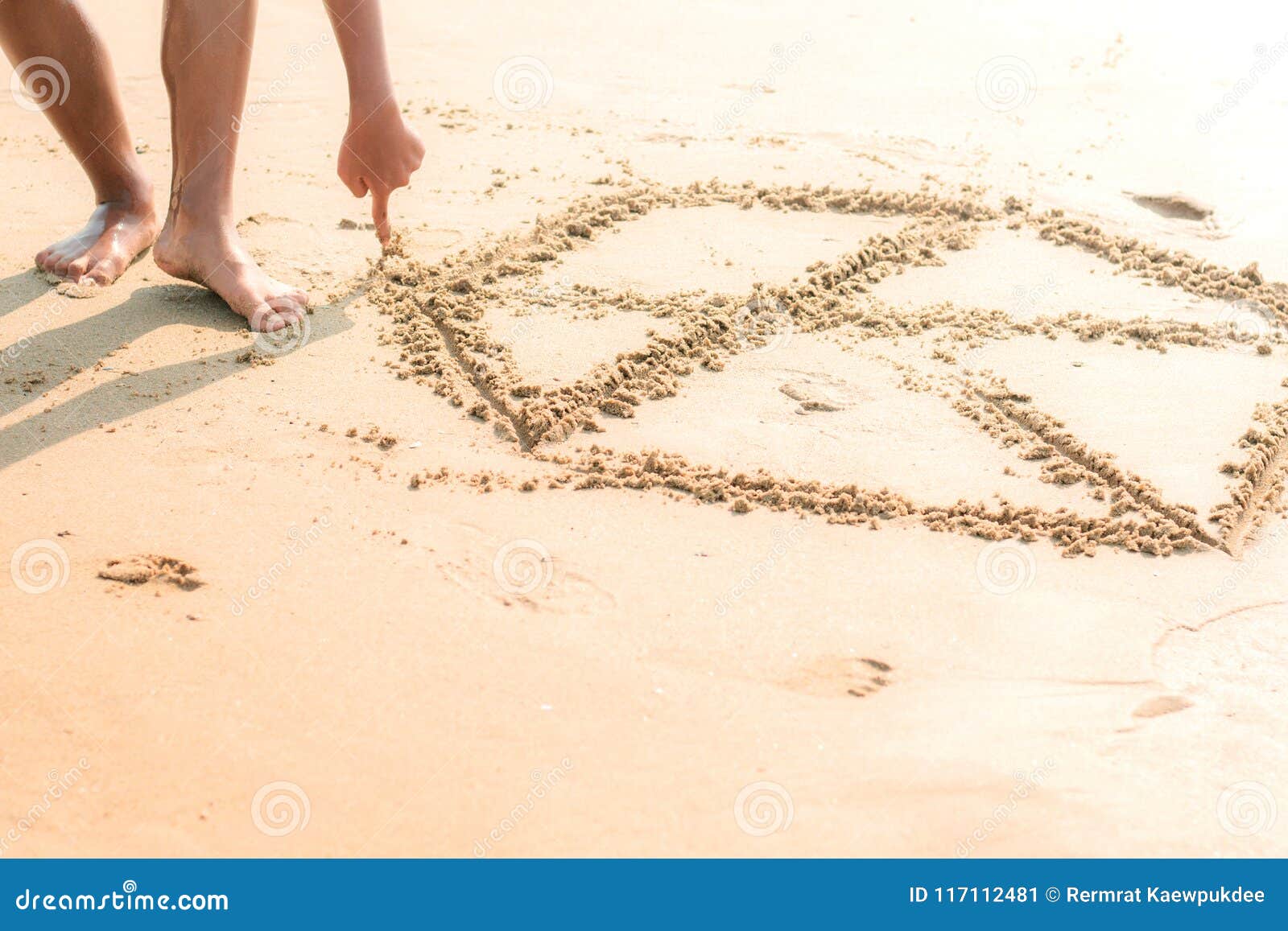 Children are Drawing on Sand. Stock Image - Image of date, ocean: 117112481