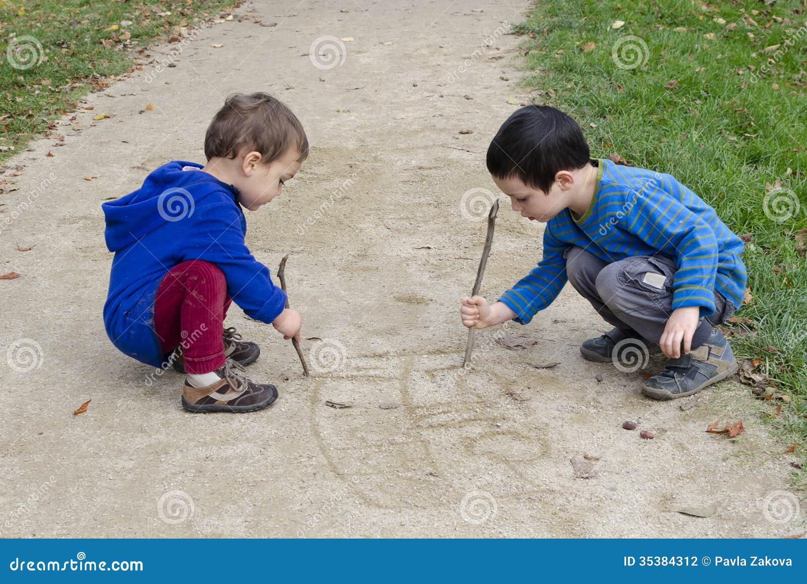 Children Drawing Into Sand Stock Photography | CartoonDealer.com #35384312
