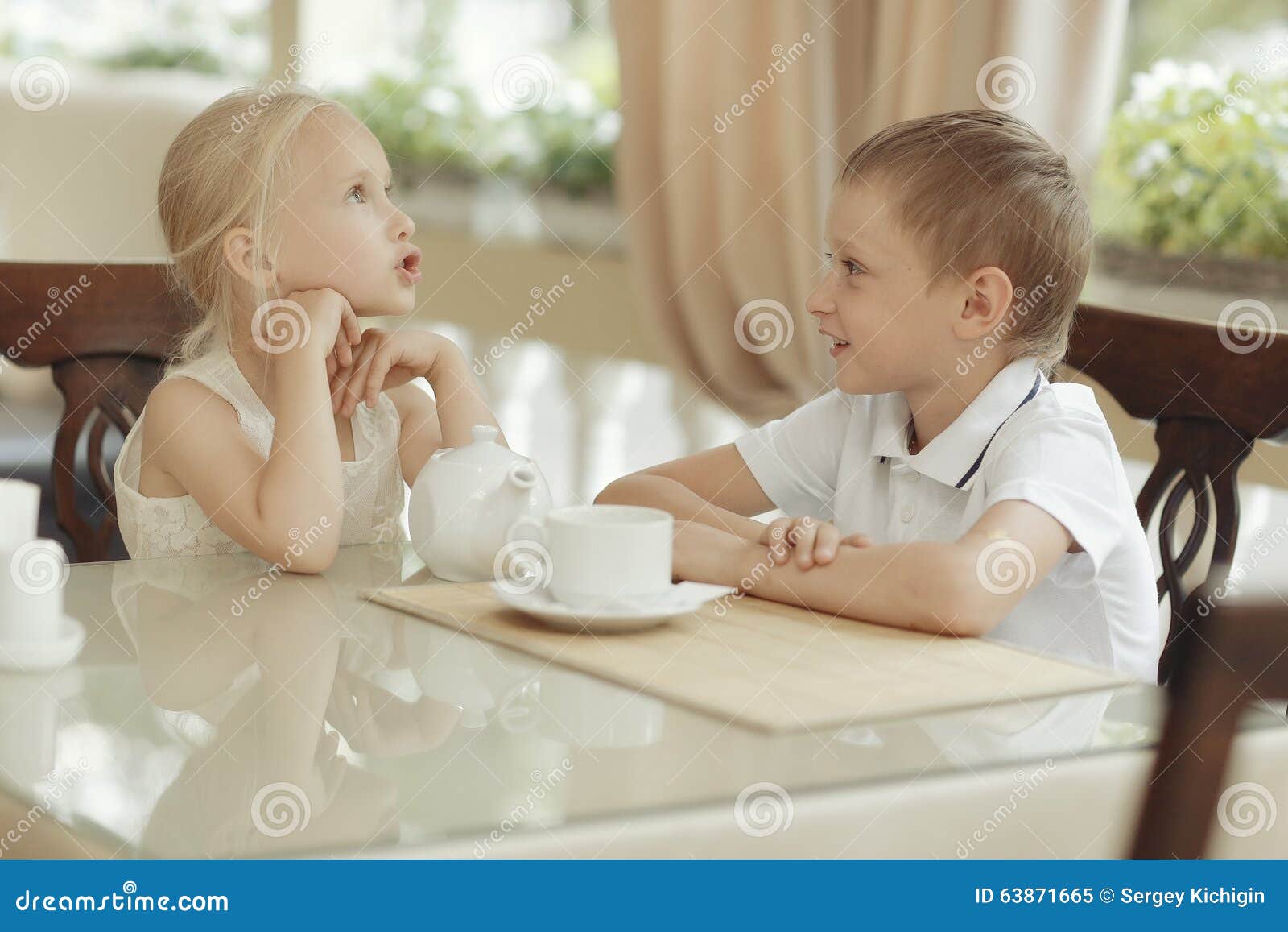 Children drink tea in cafe stock image. Image of children - 63871665
