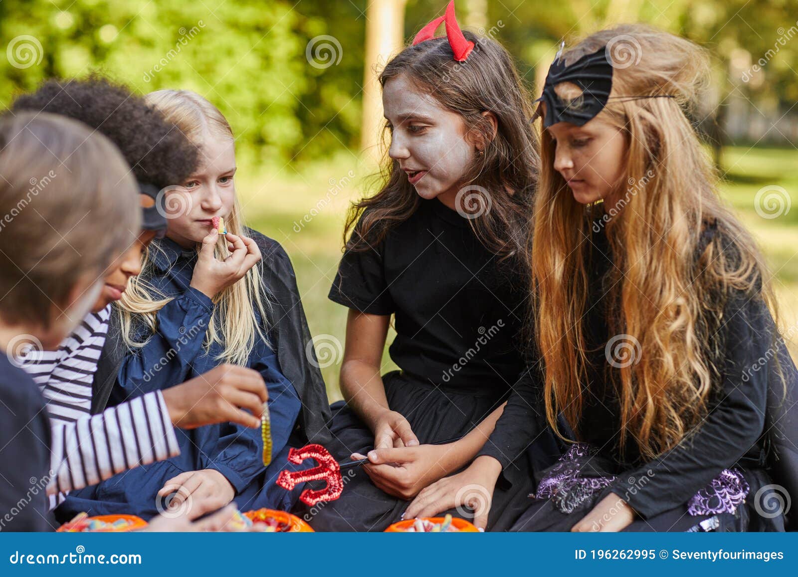 Children Eating Candy on Halloween Stock Image - Image of child, summer ...