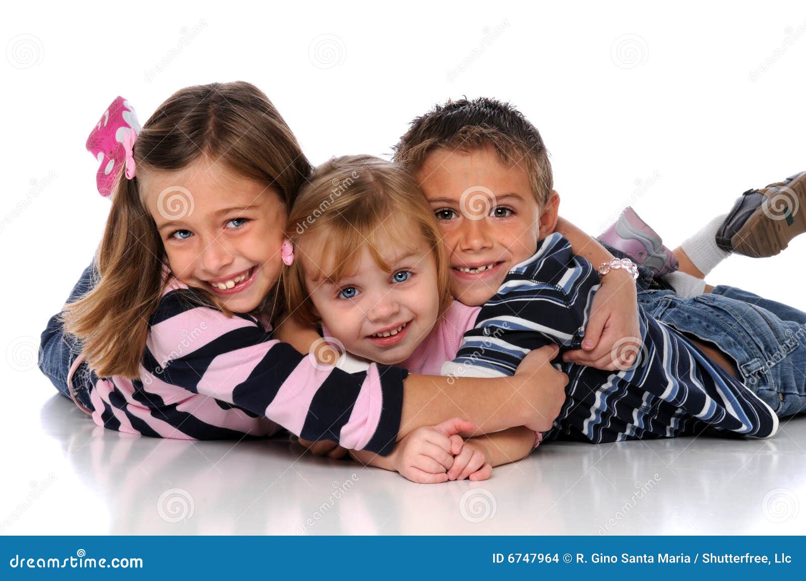 Children Embracing Laying on the Floor Stock Photo - Image of smiling ...