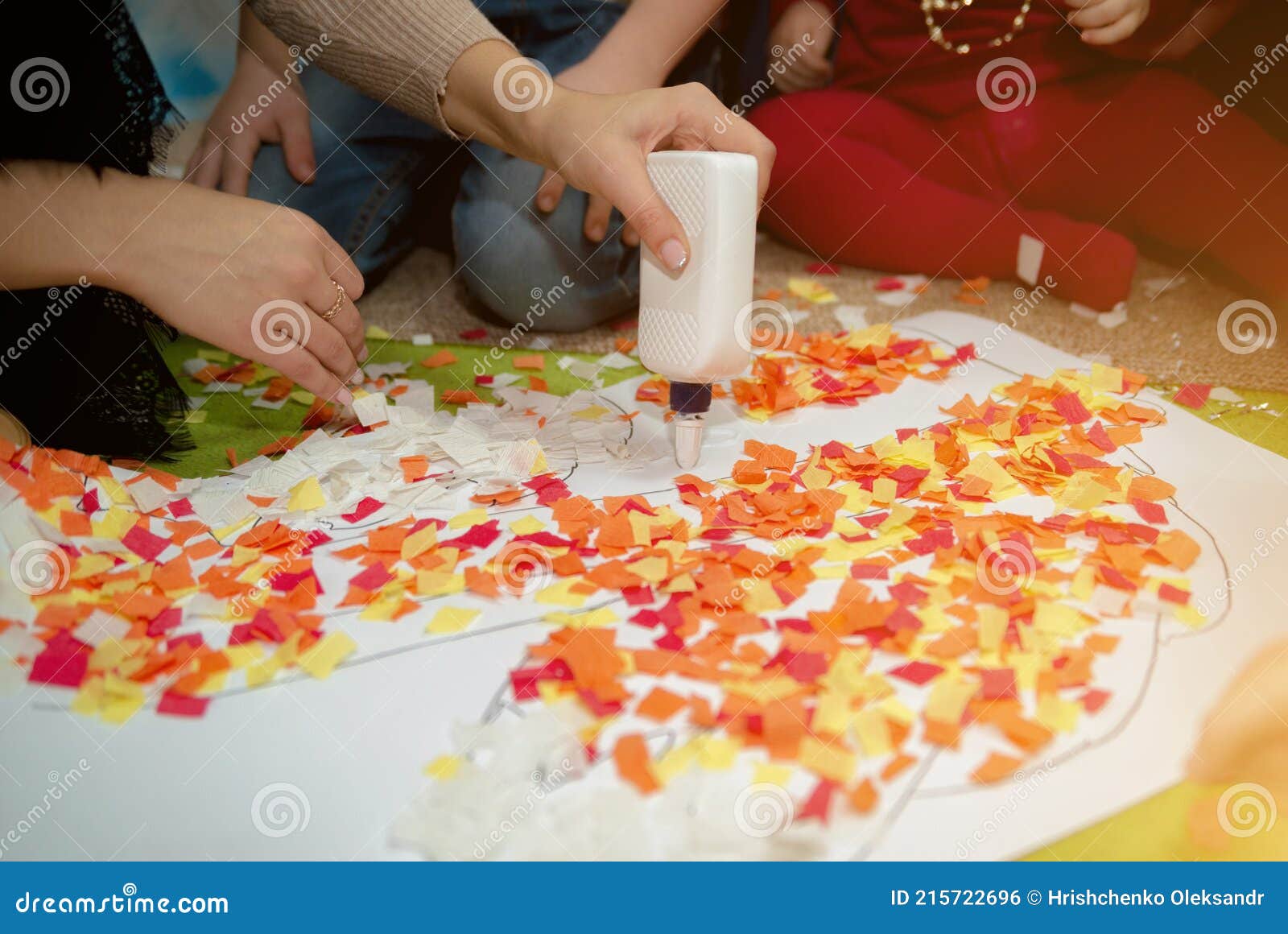 Children are Engaged in Creativity. Multi-colored Pieces of Paper Cut ...