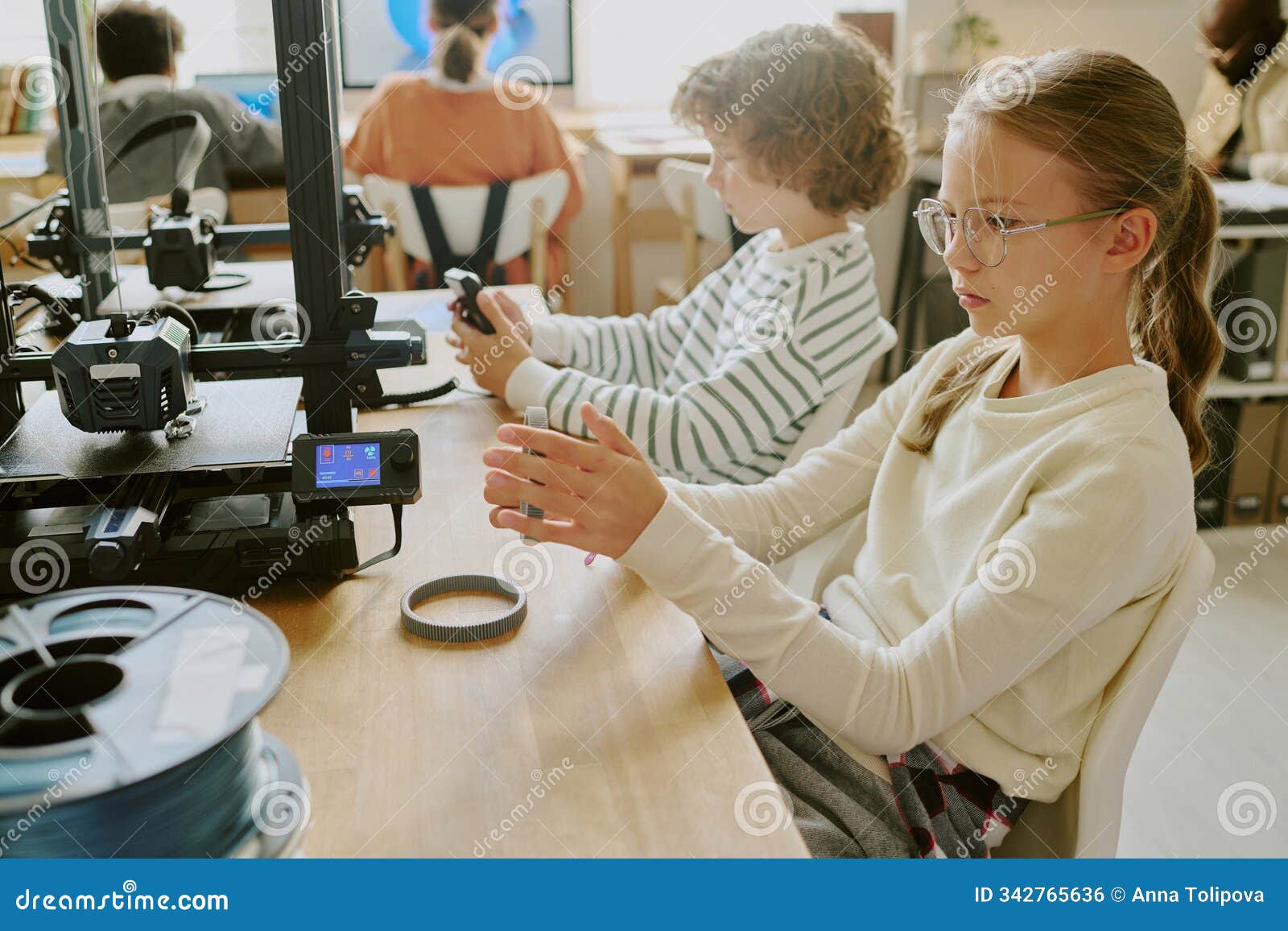 Children Engaging with Technology in Classroom Setting Stock Photo ...