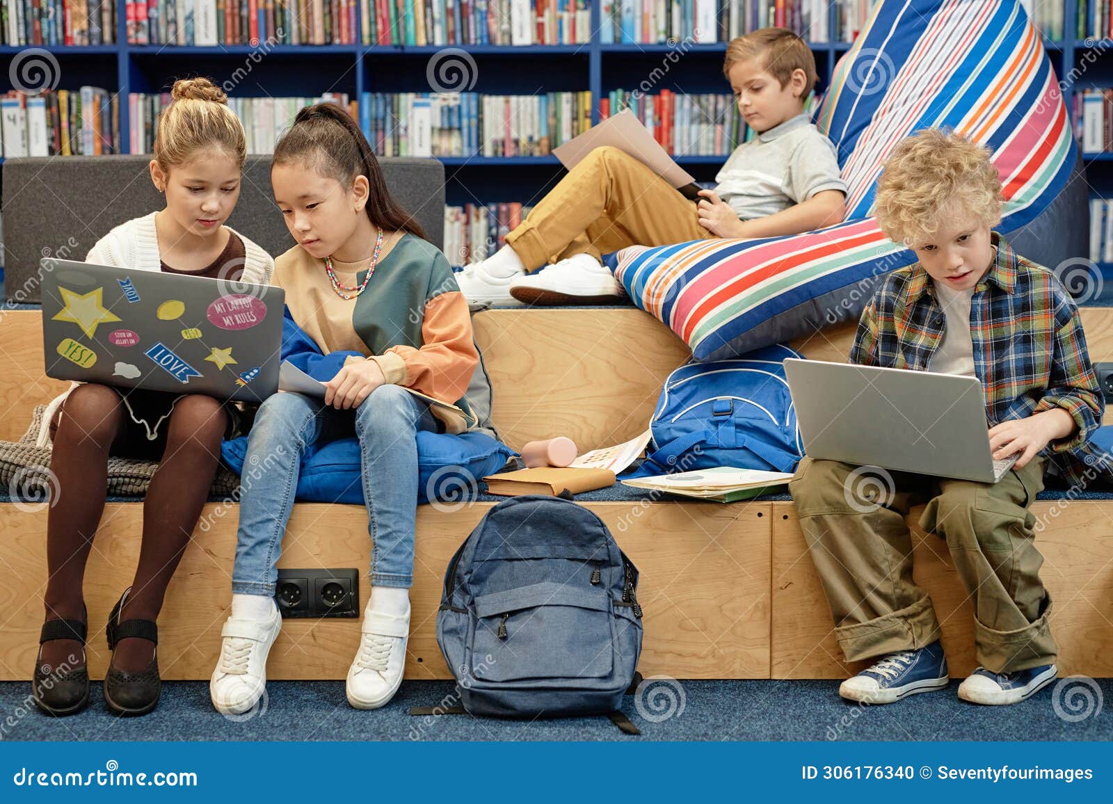 Children Enjoying Break in Library in School Stock Photo - Image of ...