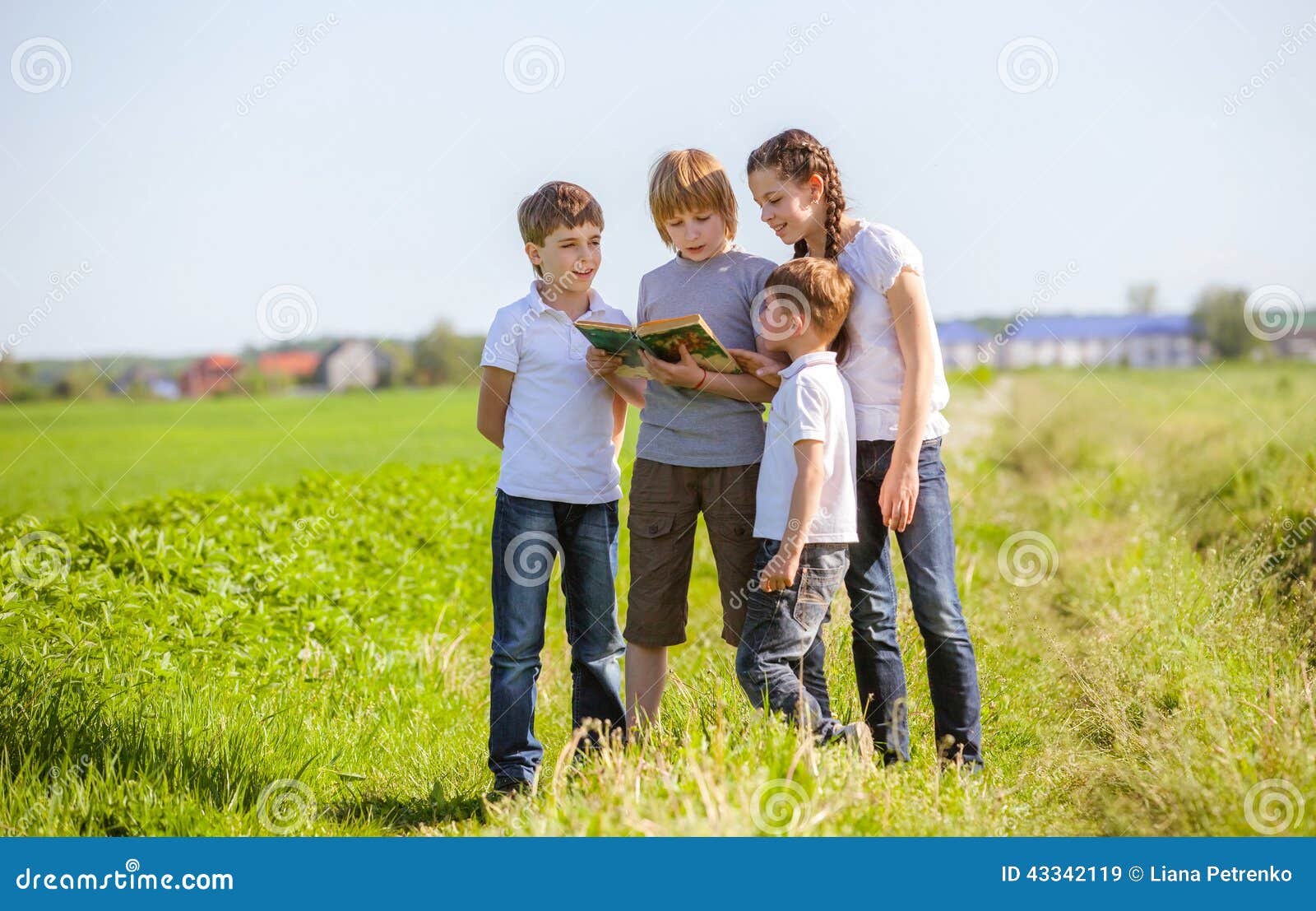 Children enjoying reading stock image. Image of lawn - 43342119