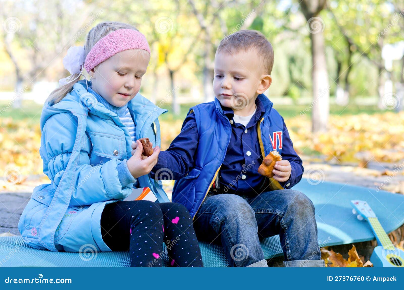 Children Enjoying a Snack in the Park Stock Photo - Image of food ...