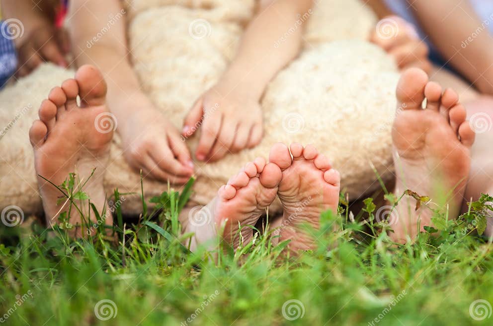 Children feet on a grass stock image. Image of recreational - 25821033