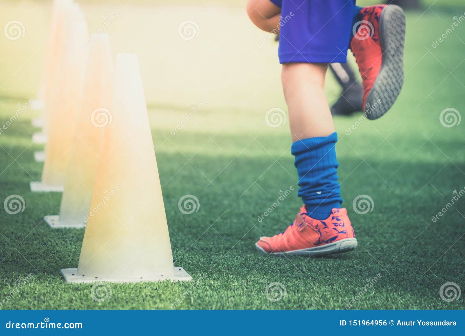 Children Feet with Soccer Training on Training Cone on Soccer Ground ...