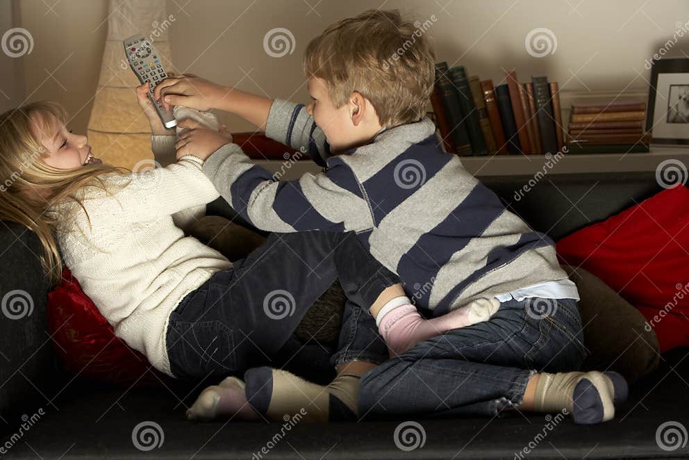 Children Fighting Over Remote Control Stock Photo - Image of jeans ...